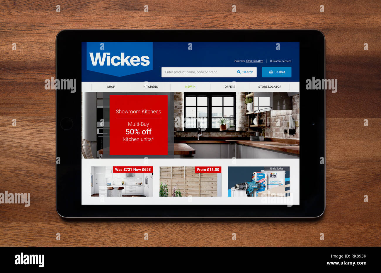 The website of Wickes is seen on an iPad tablet, which is resting on a ...