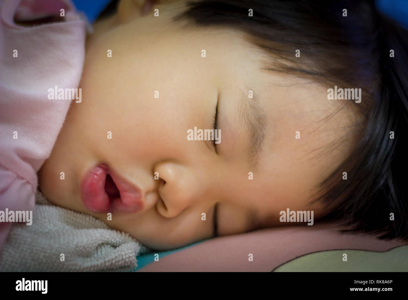 Cute Asian baby sleeping Stock Photo - Alamy