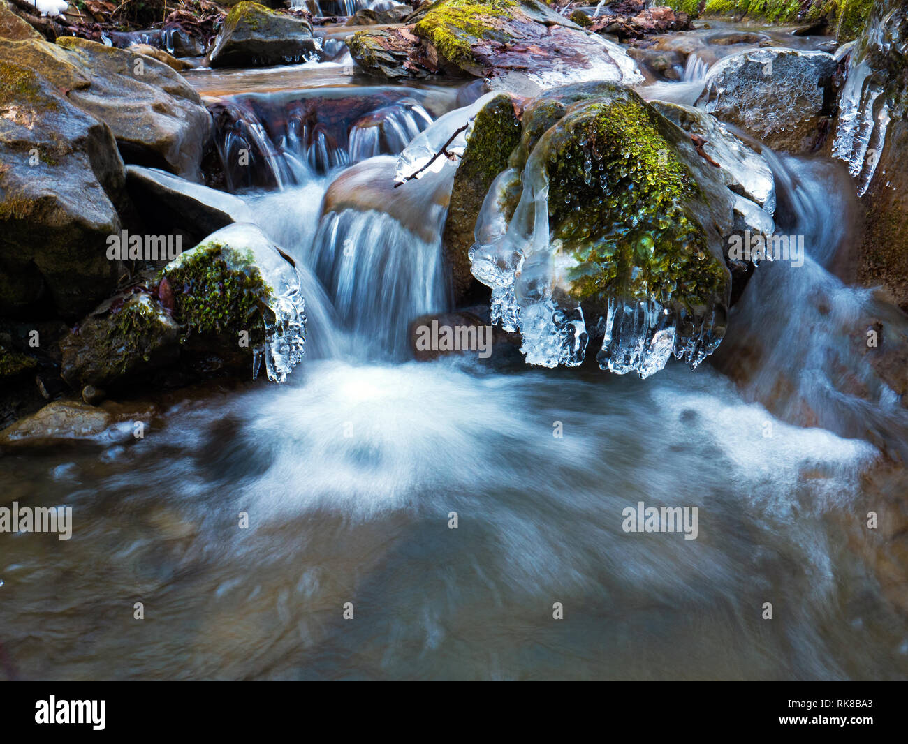 A frozen waterfall in winter in a little river Stock Photo - Alamy