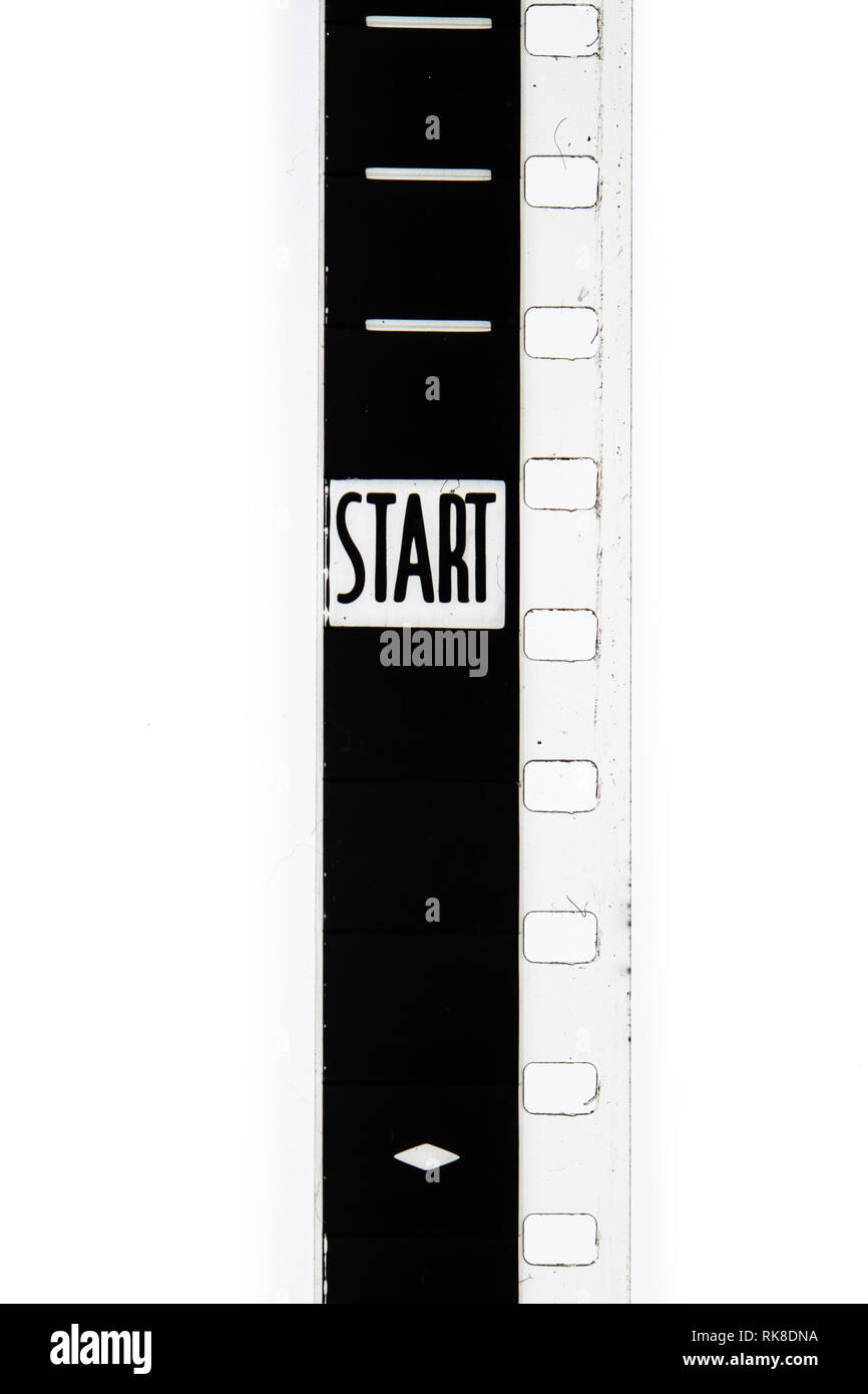 Extreme close up of 8mm movie film strip with start text message on ...