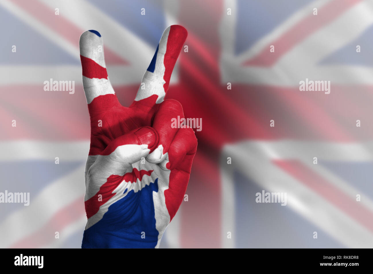 Hand making victory sign, united kingdom painted with flag as symbol of ...