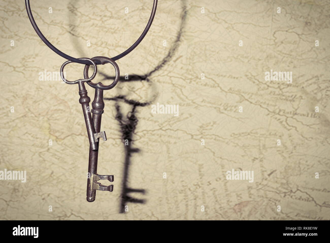 Old antique vintage key on rustic background Stock Photo - Alamy