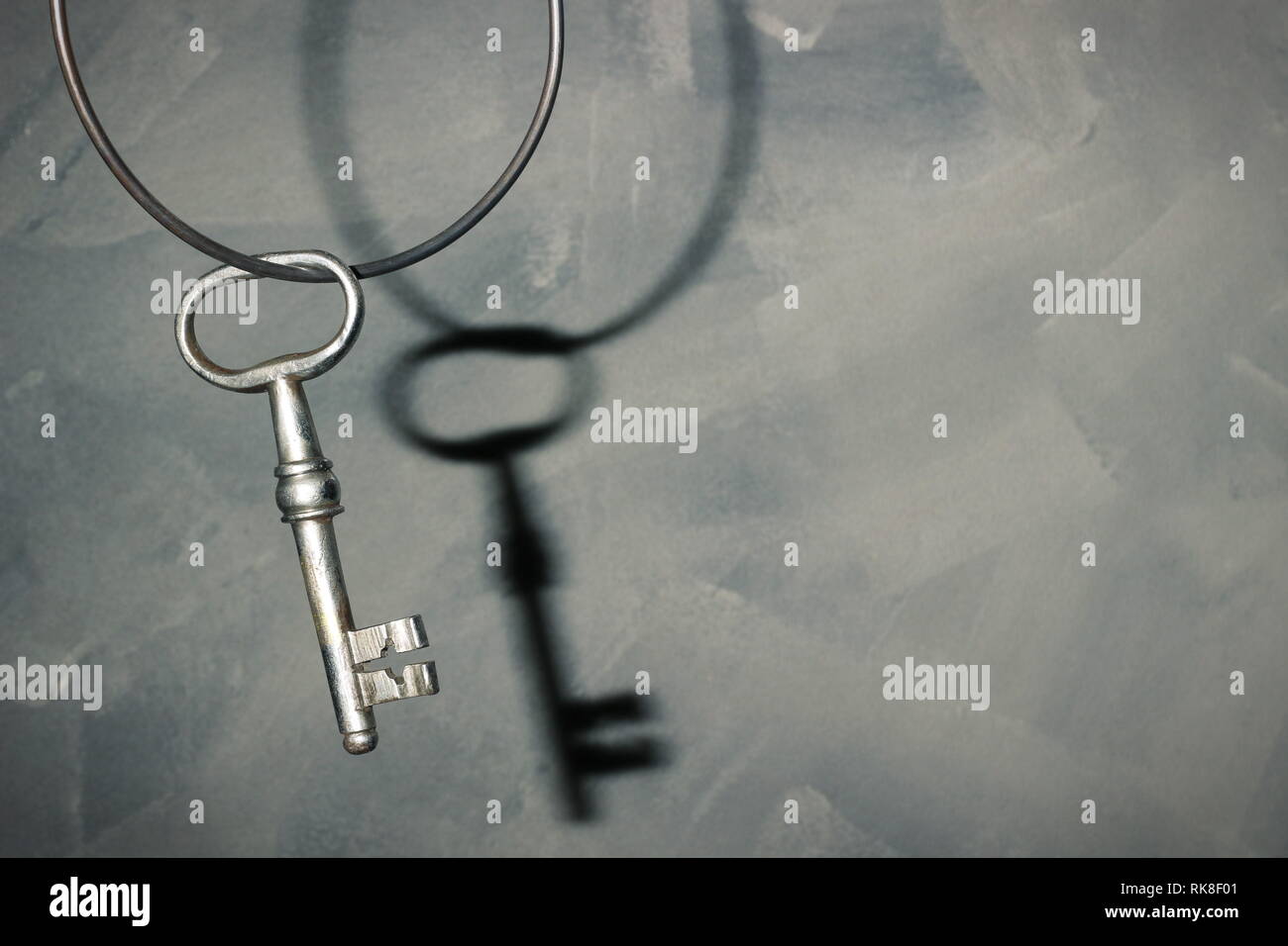 Old antique vintage key on rustic background Stock Photo - Alamy