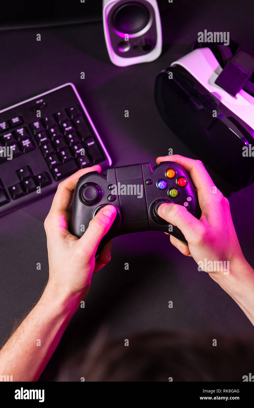 Man hands playing a computer game with a game joystick Stock Photo - Alamy