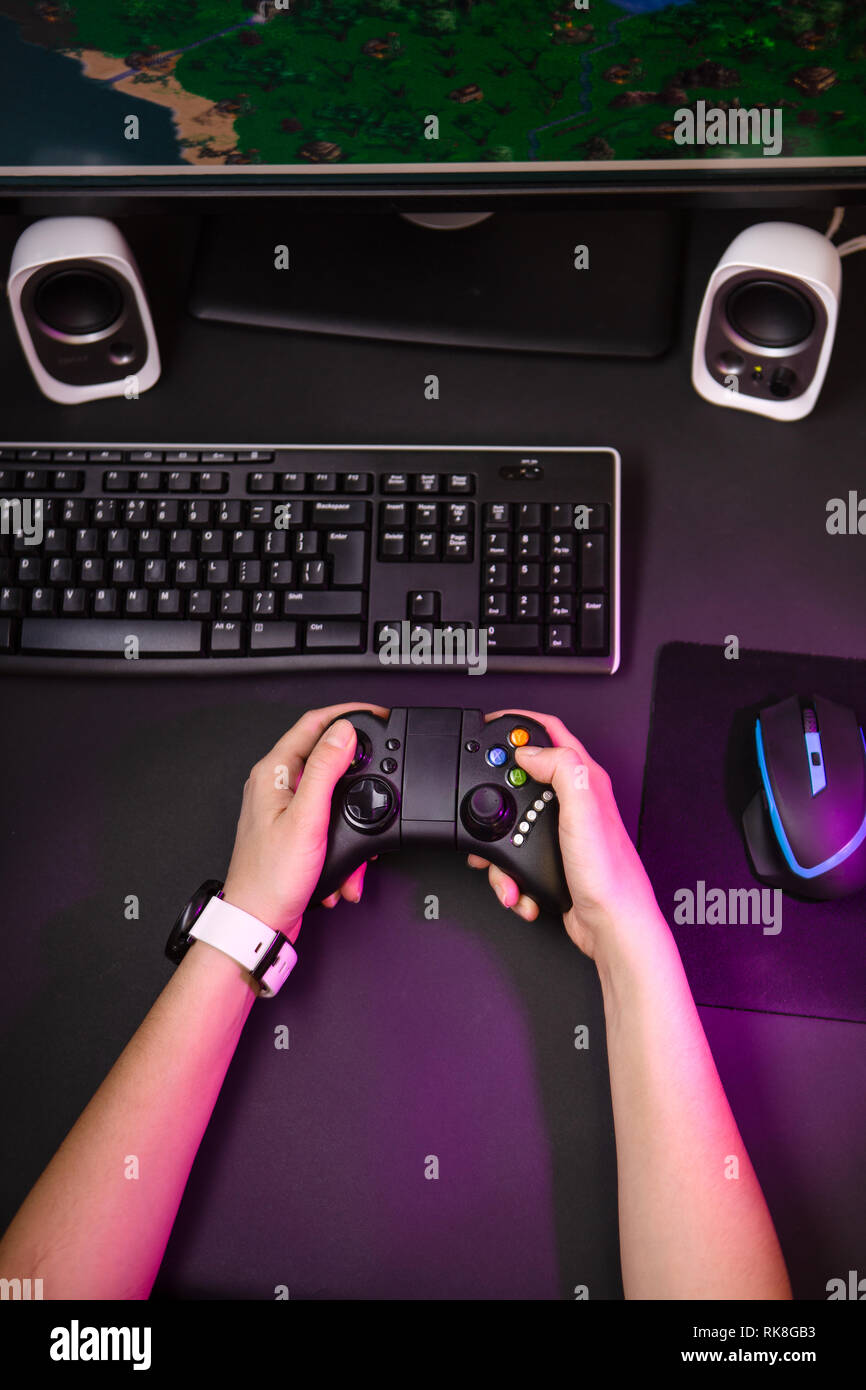Female hands playing a computer game with a game joystick Stock Photo ...
