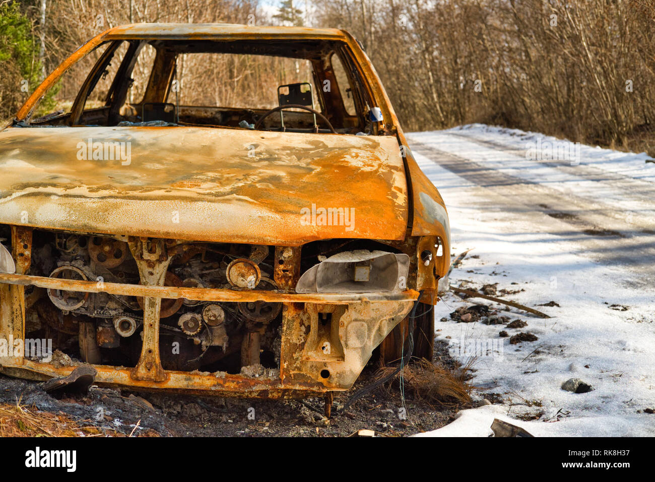Burnt out car by side of icy road, Sweden, Scandinavia Stock Photo - Alamy