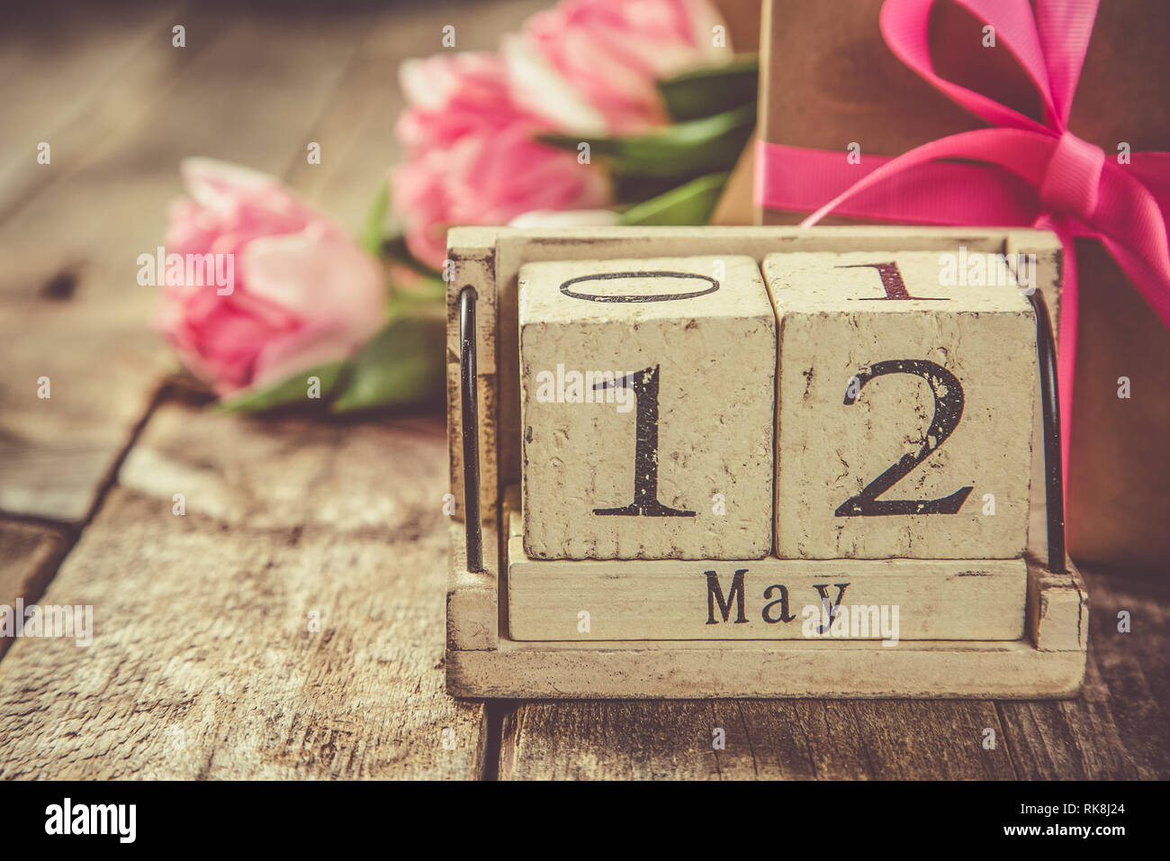 Mother's day concept - flowers, present, calendar Stock Photo - Alamy