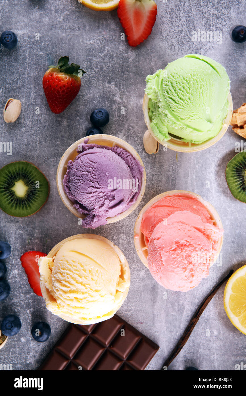 Set of ice cream scoops of different colors and flavours with berries ...