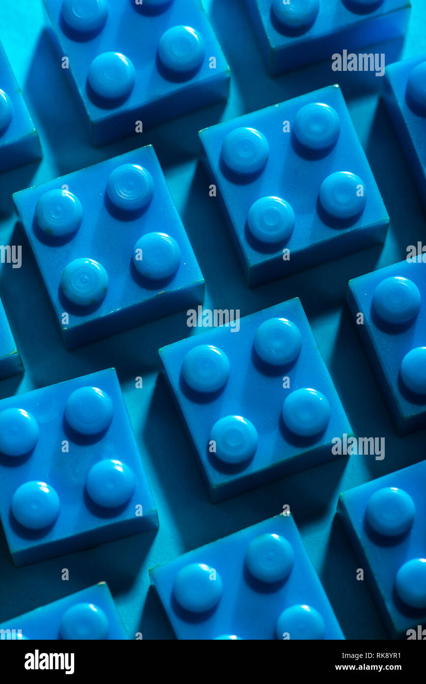 Blue unicolour plastic geometric cubes. Construction toys on geometric ...