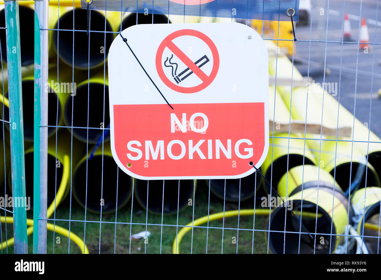 No smoking construction safety sign and yellow gas pipe for external ...