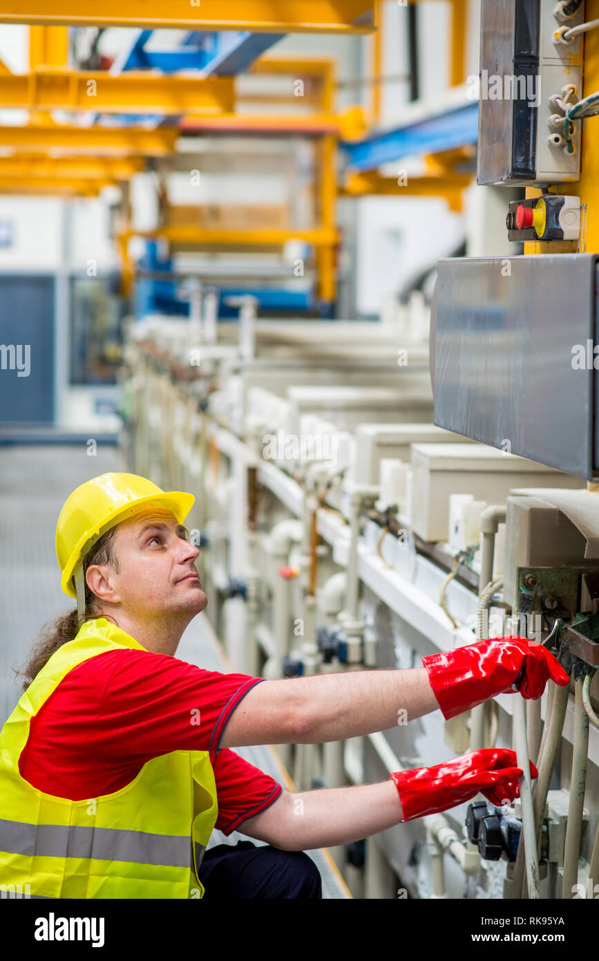 Worker in a factory Stock Photo - Alamy