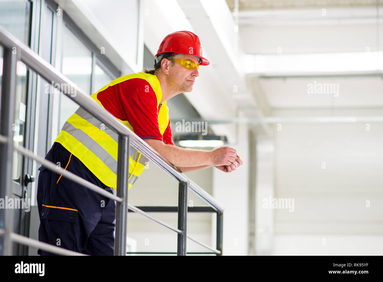 Supervisor monitoring work in a factory Stock Photo - Alamy