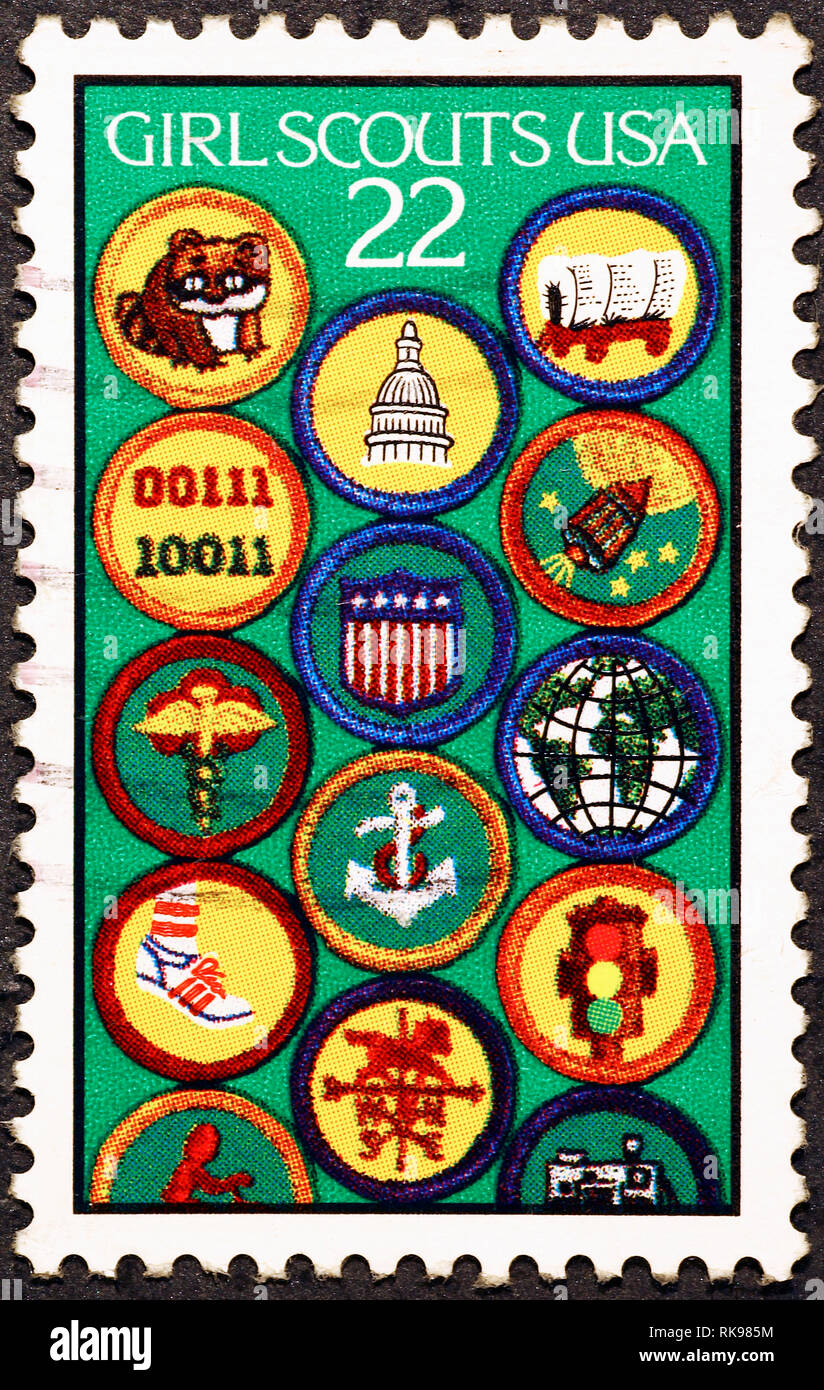 Badges of girl scouts on american postage stamp Stock Photo - Alamy