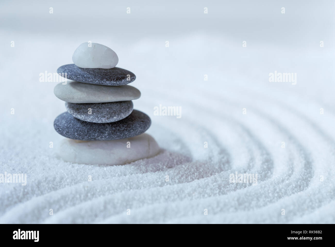 Miniature Zen Garden with the stack of pebbles Stock Photo - Alamy