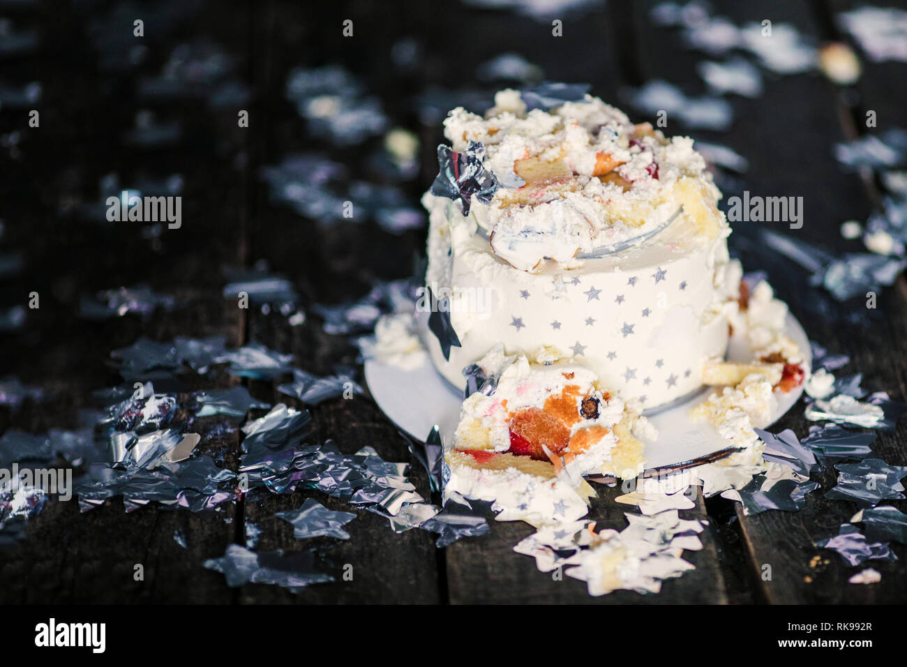 Smashed first birthday white cake with stars and one candle for little ...