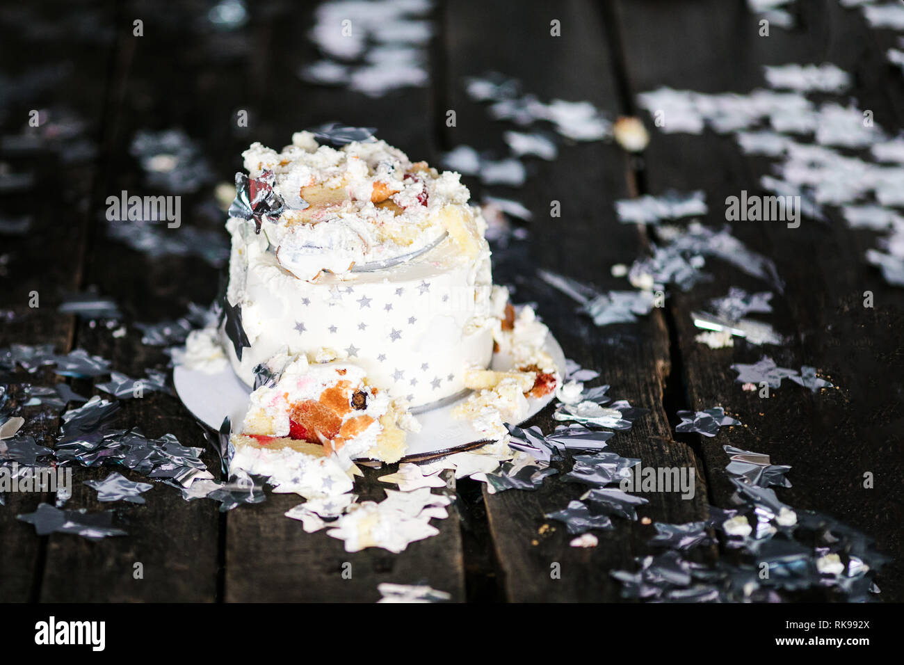 Smashed first birthday white cake with stars and one candle for little ...