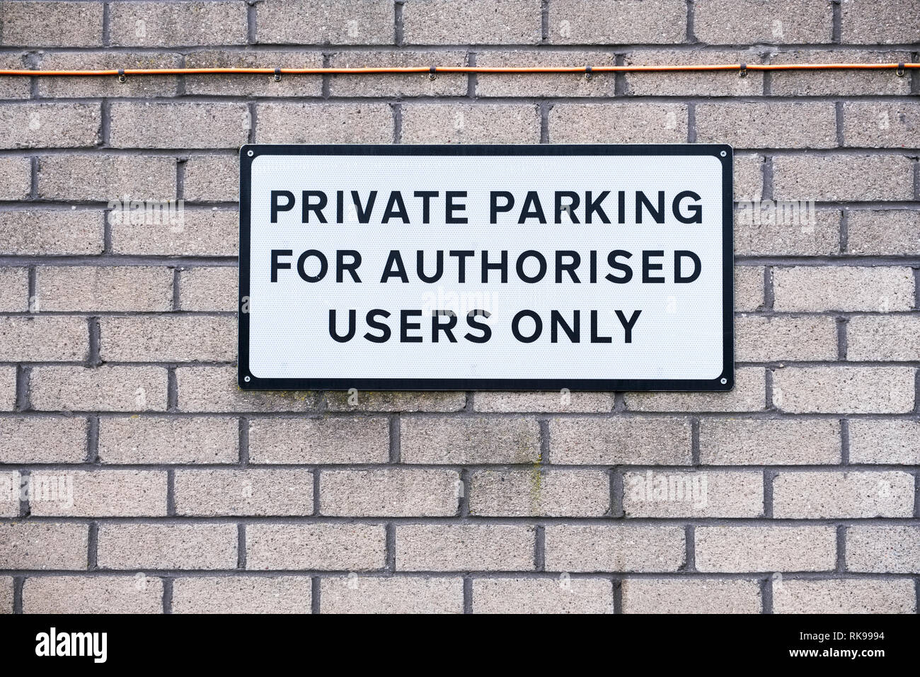 Private parking authorised users only sign Stock Photo - Alamy