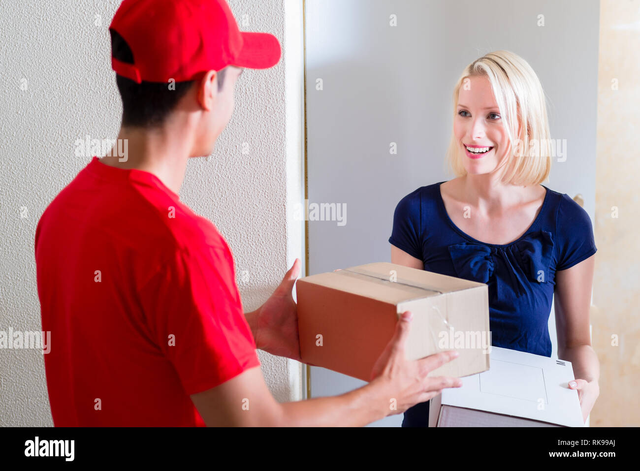 Happy customer receiving package from hi-res stock photography and ...