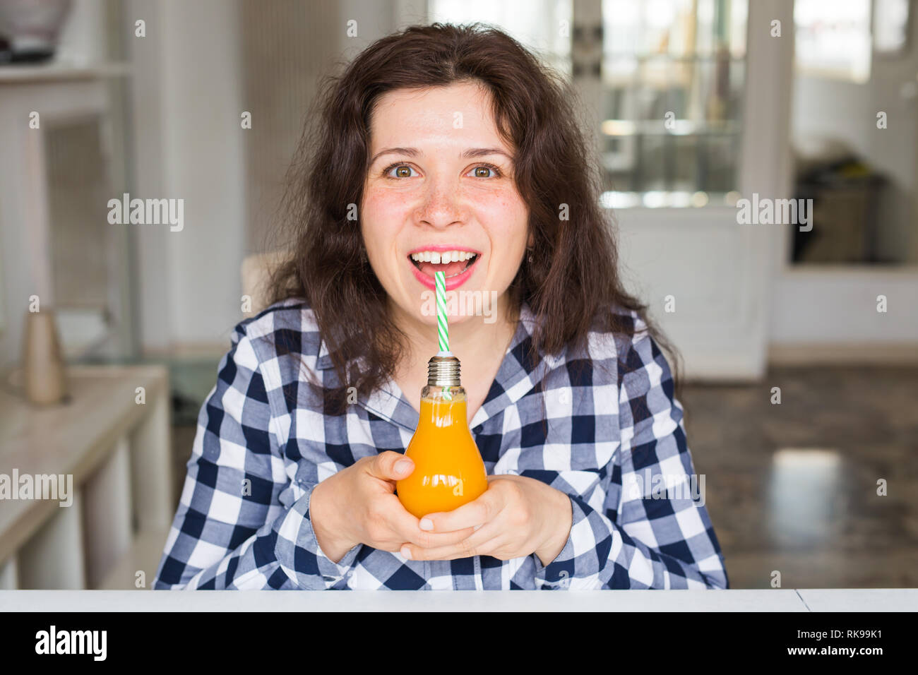 Lifestyle, drink and people concept - Beautiful young woman drinking ...