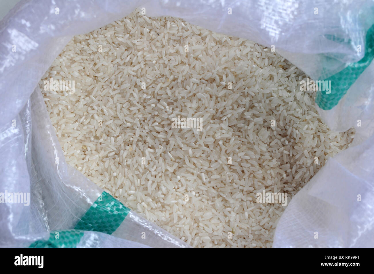Rice on white sack Stock Photo - Alamy