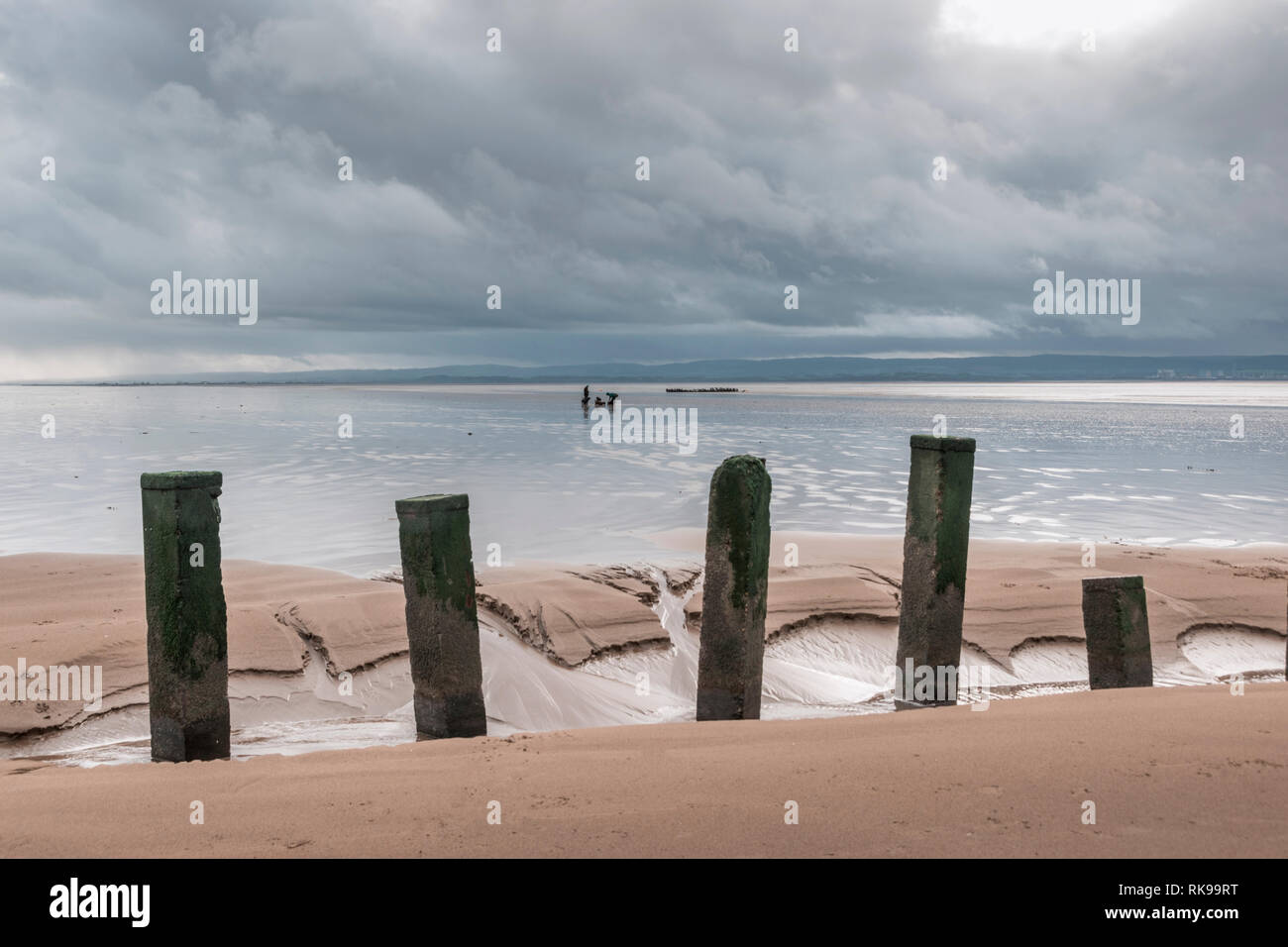 Row of groins reaching out to sea on the beach at Berrow Sands near ...