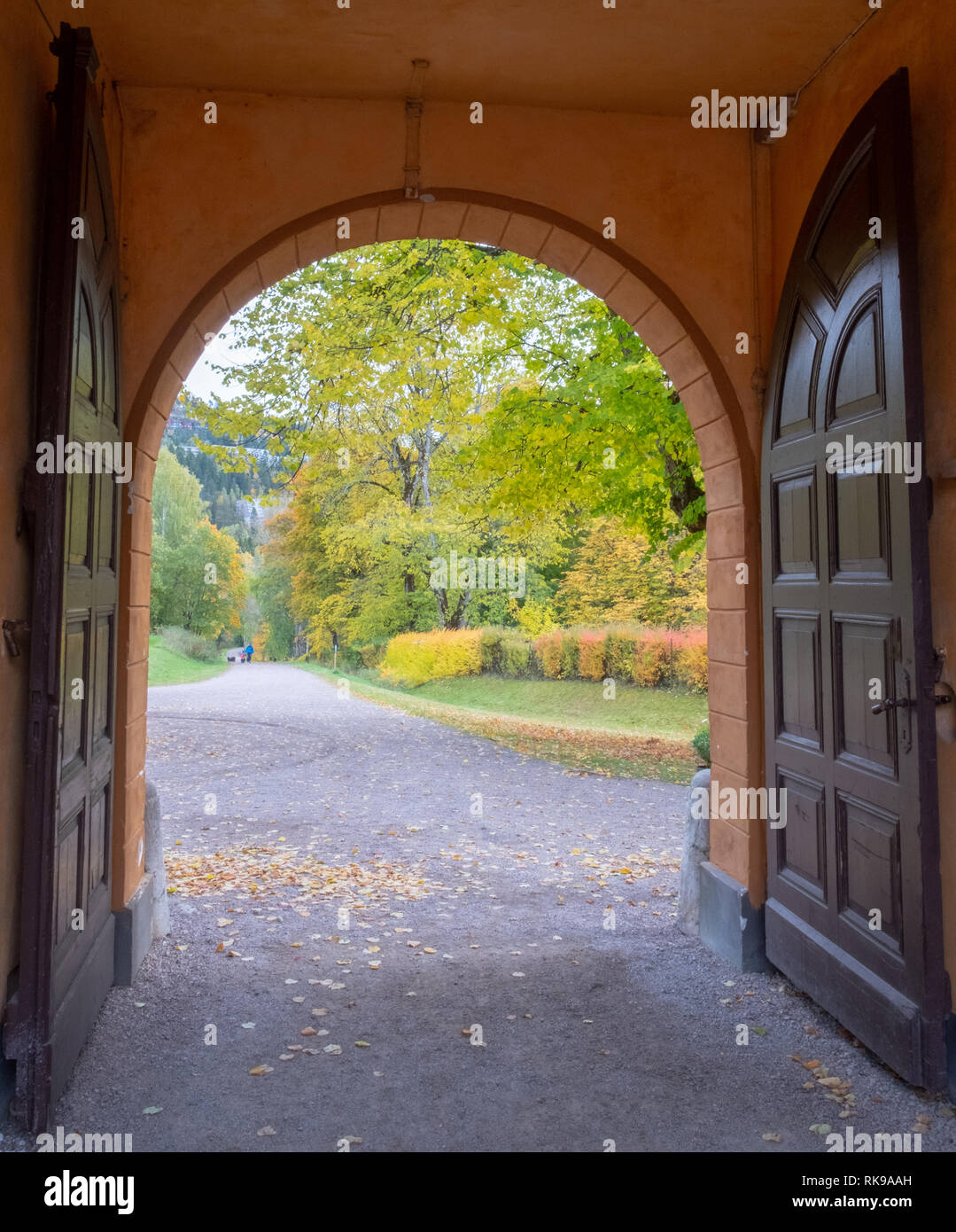 Gate opens to an autumn park view Stock Photo - Alamy