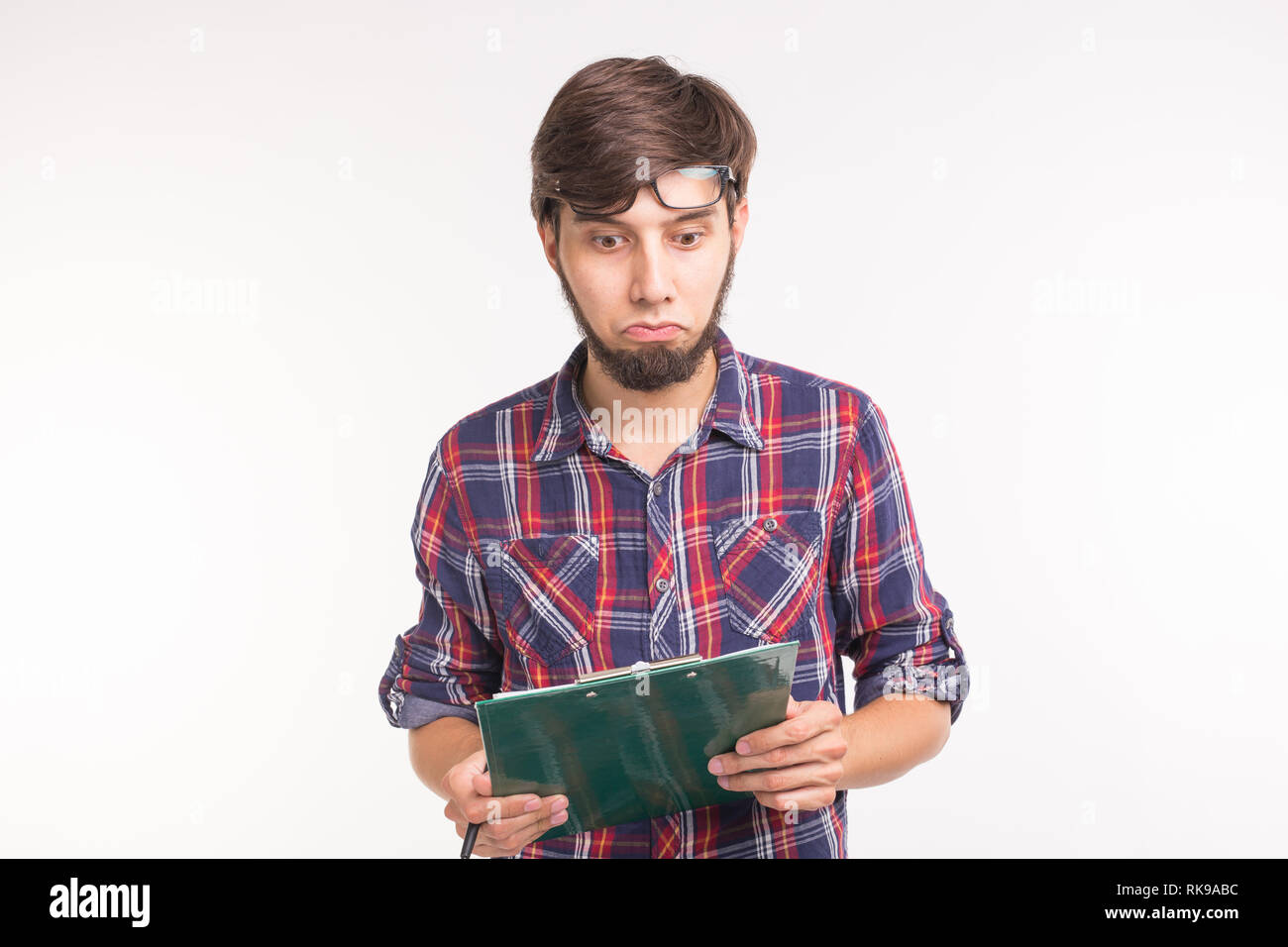 People, working and joke concept - funny man with clipboard thinking on ...
