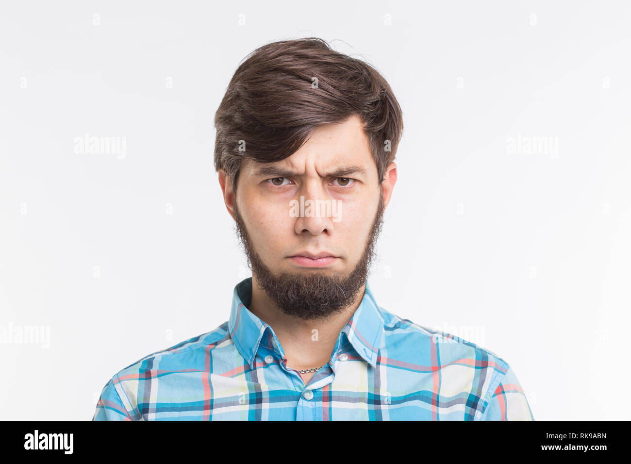 People, gesture and emotions concept - Sad or angry bearded man on ...