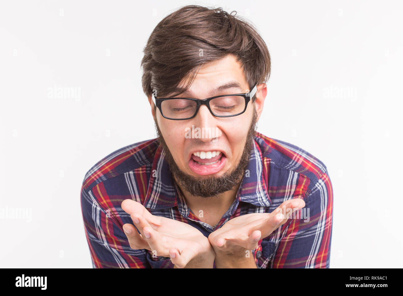 People, feelings and gesture concept - scared man hiding behind his ...