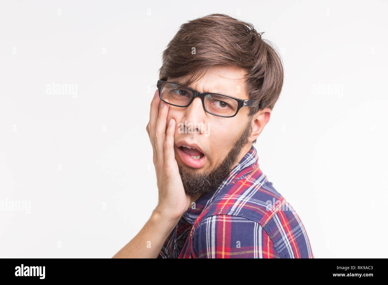 Expression and gesture concept - Handsome man with awkward face Stock ...