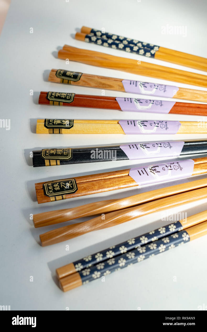 a selection of colourful chopsticks laid out on display Stock Photo - Alamy