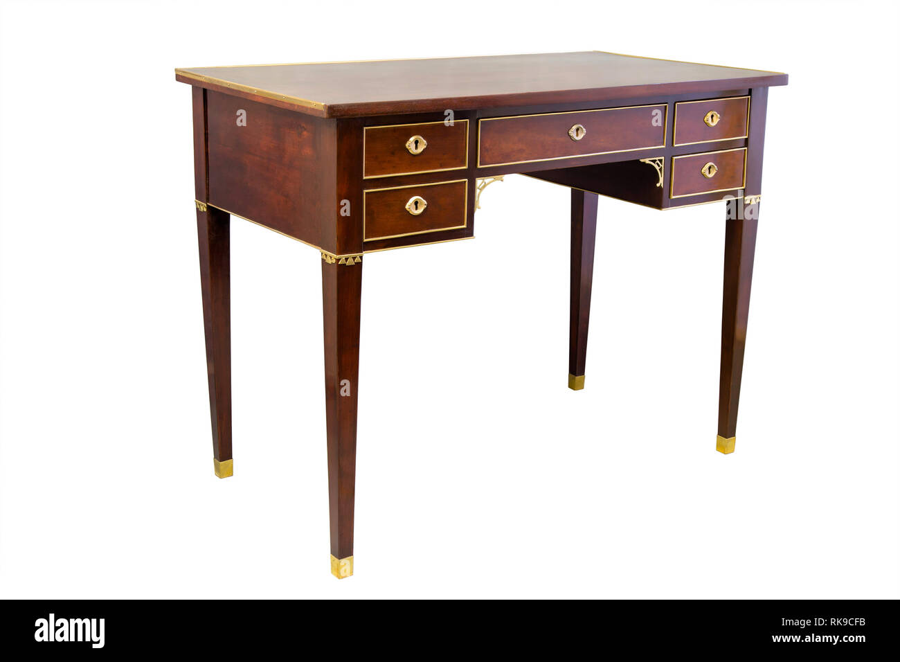 Antique hard wood writing desk with brass inlay, isolated on white ...