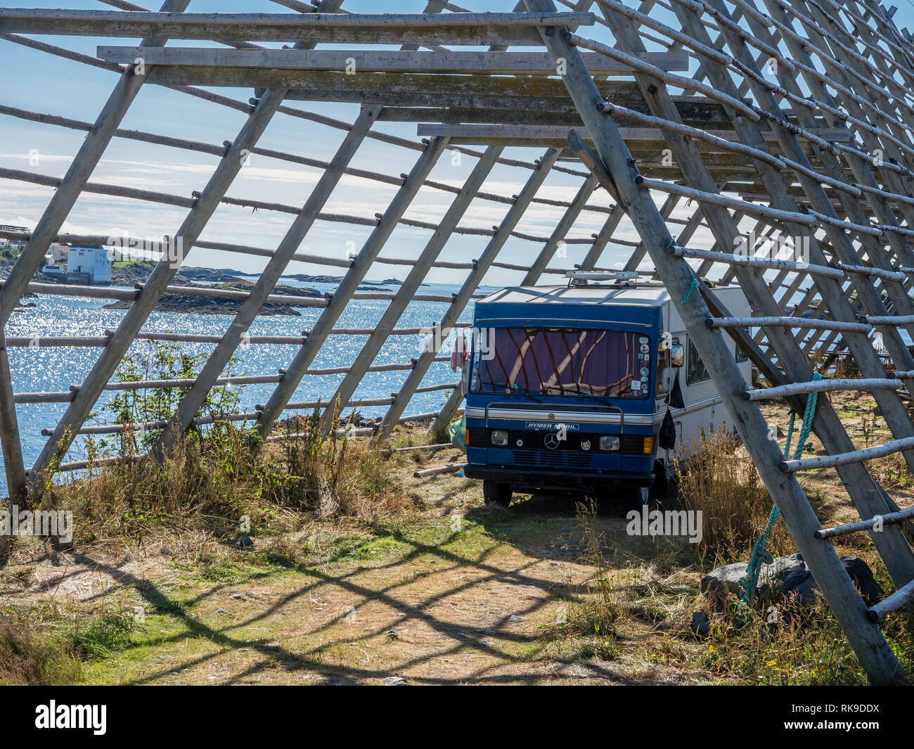 Mobile home, oldtimer, parks below wooden drying rack usually used to ...