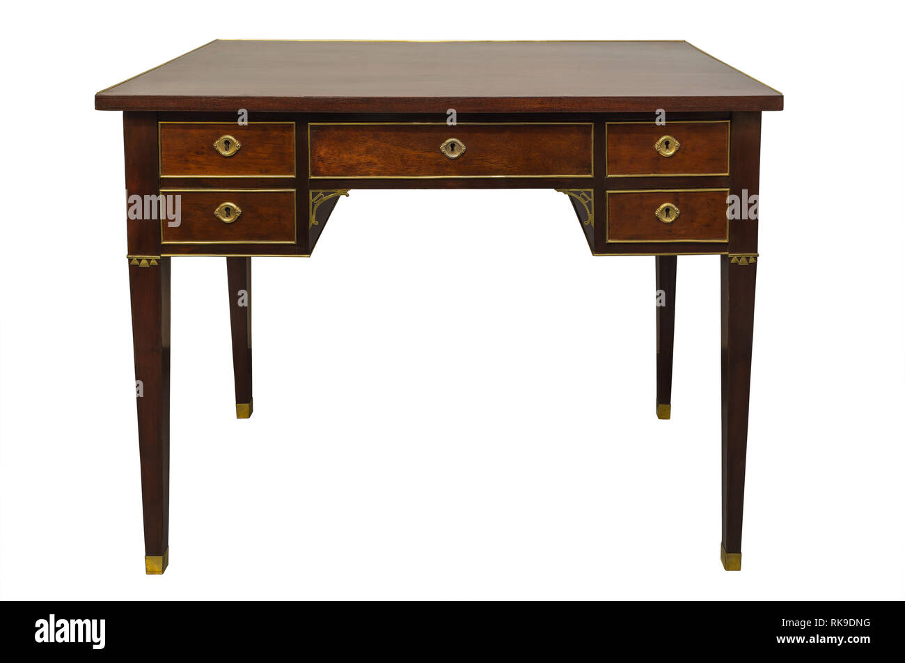 Antique hard wood writing desk with brass inlay, isolated on white ...