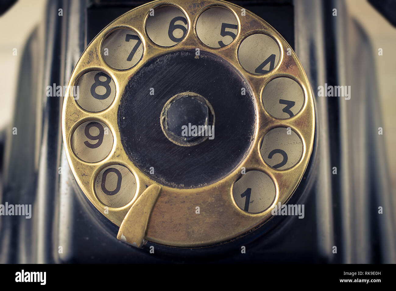 Old vintage telephone with brass rotary dial Stock Photo - Alamy