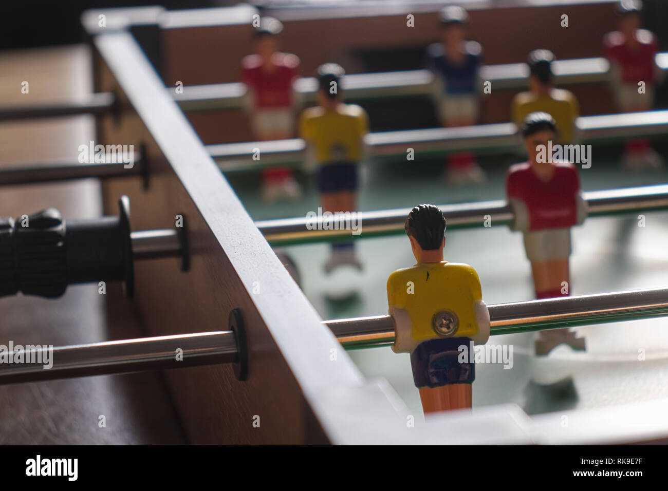 Table football with yellow and red kickers Stock Photo - Alamy