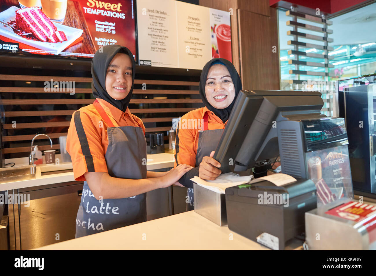 KUALA LUMPUR, MALAYSIA - MAY 09, 2016: Staff members of McCafe. McCafe ...