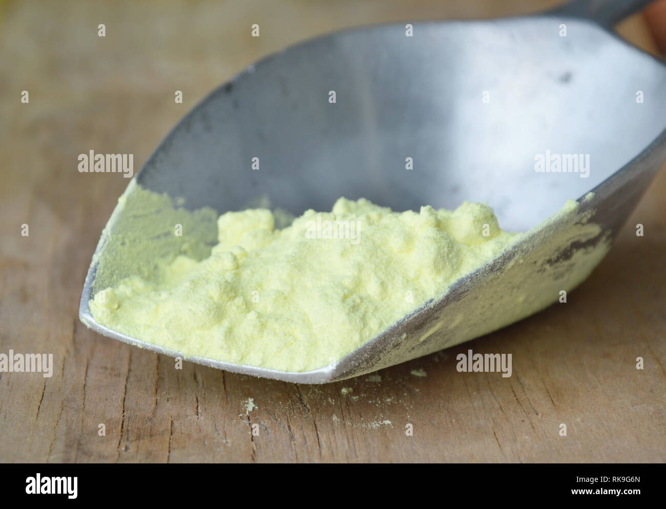 sulphur powder on iron scoop Stock Photo - Alamy