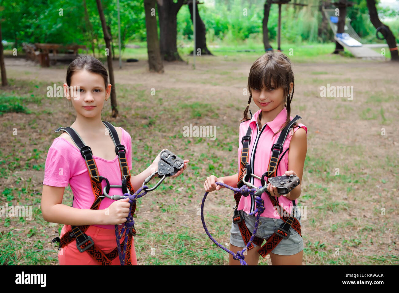 adventure climbing high wire park - hiking in rope park two girls Stock ...