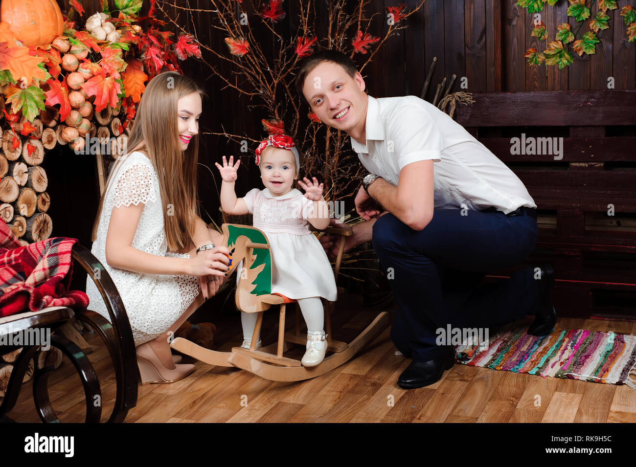 Lovely family smiling and laughing, posing at camera Stock Photo - Alamy