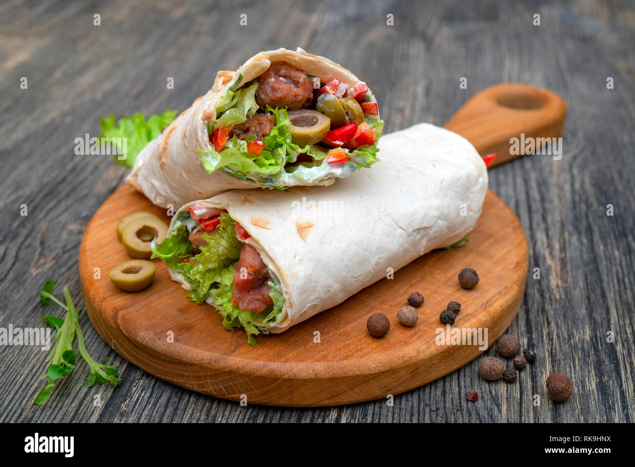 Shawarma fresh rolls with vegetables and meat Stock Photo - Alamy