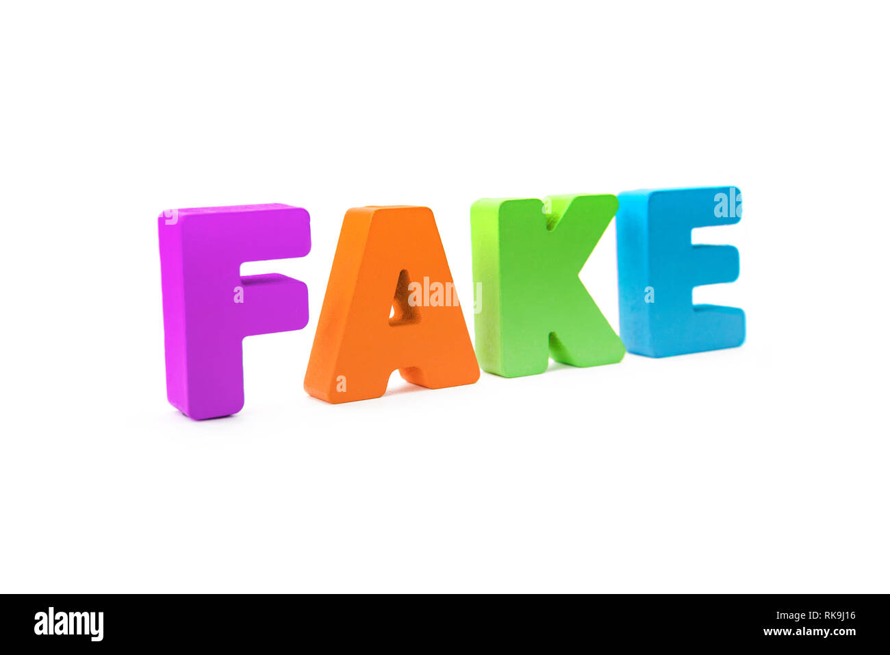Many-colored isolated wooden word FAKE made with 3d text effect ...