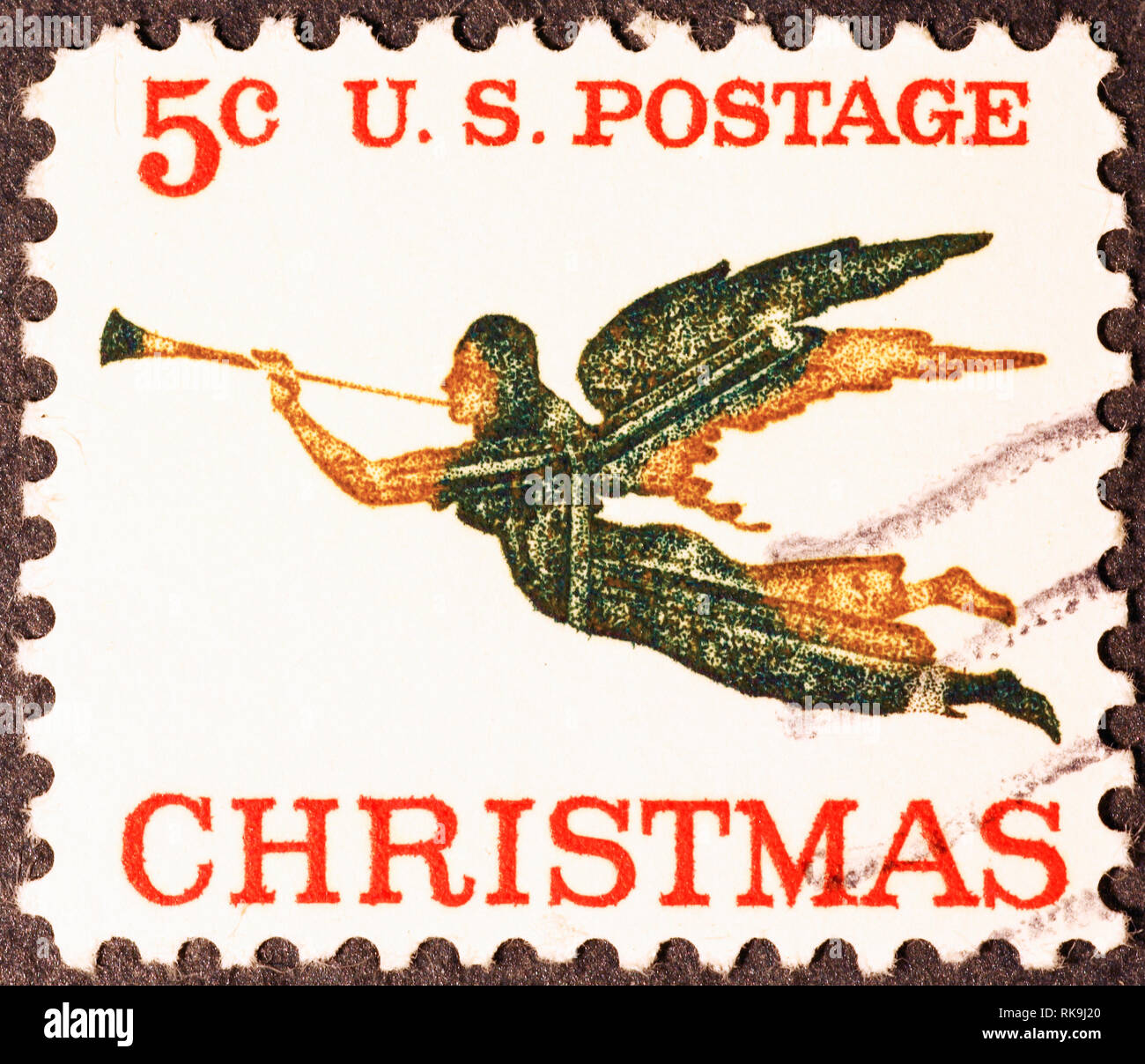 Angel playing a trumpet on american postage stamp Stock Photo - Alamy