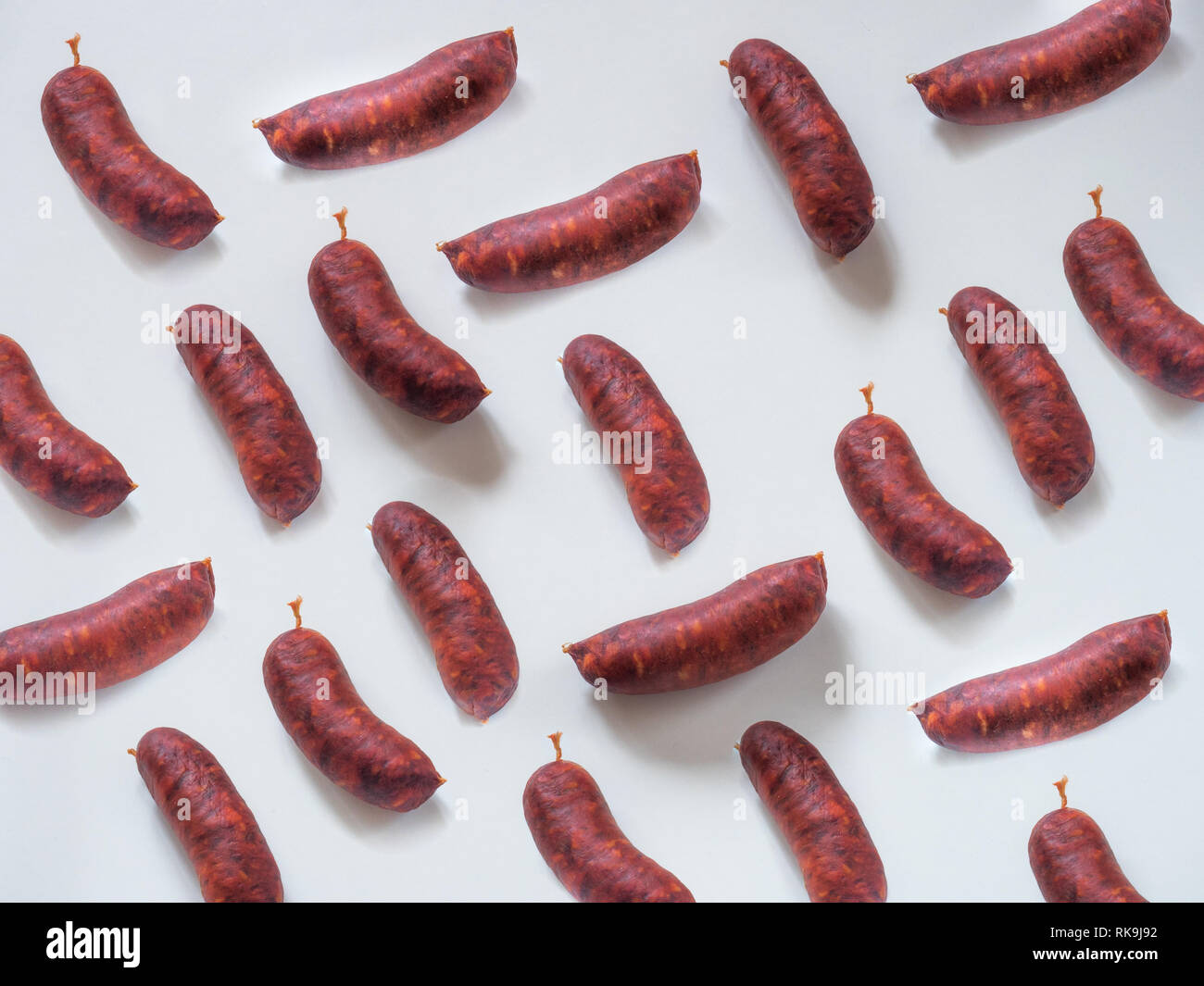 Spanish sausage pattern on white background Stock Photo - Alamy
