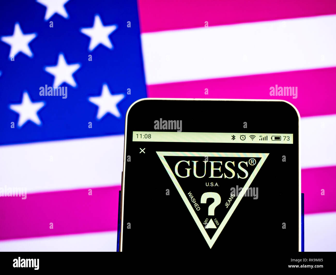 Guess Clothing company logo seen displayed on smart phone Stock Photo ...