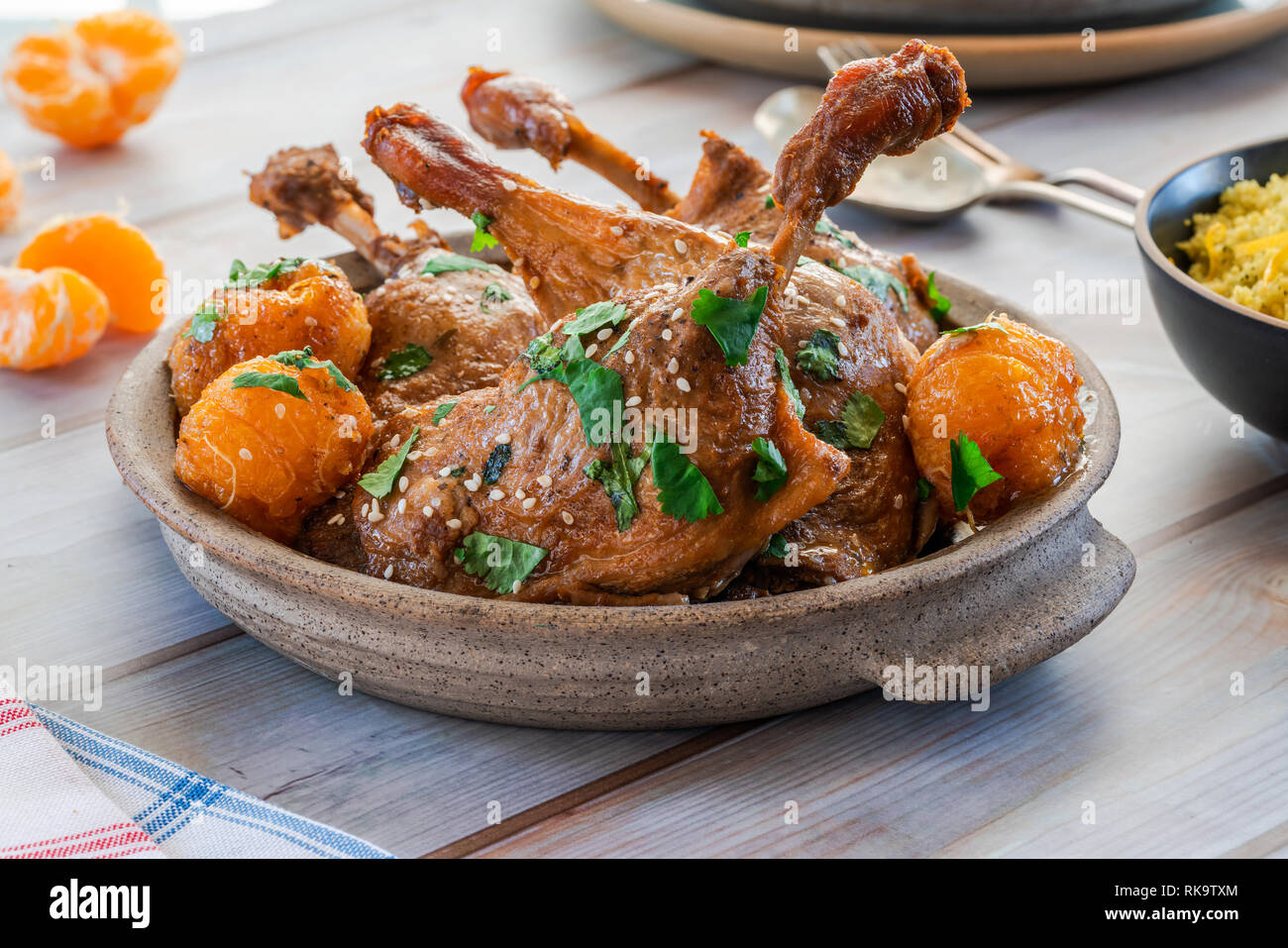 Duck tagine with clementines and citrus couscous Stock Photo - Alamy