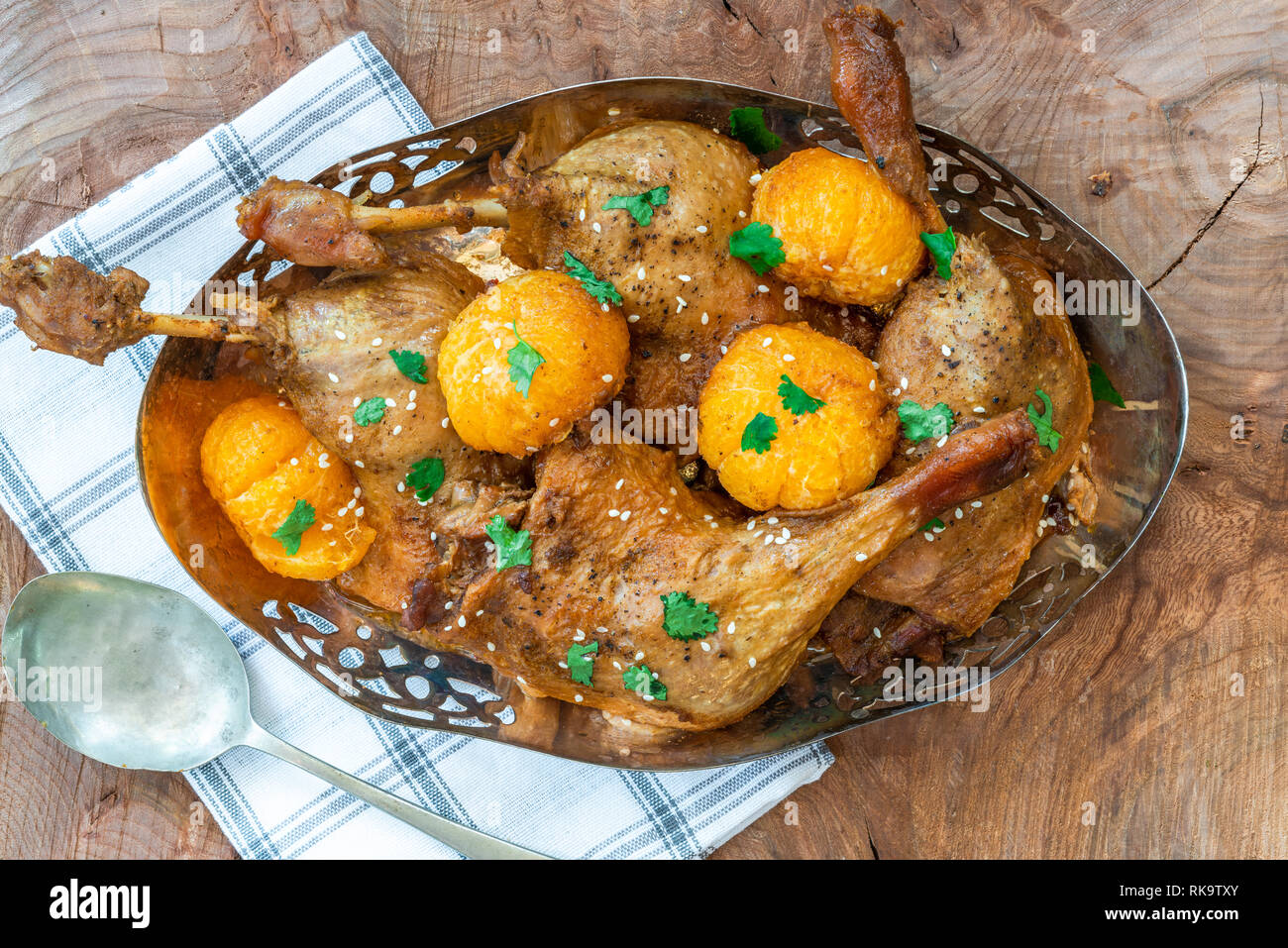 Duck tagine with clementines - top view Stock Photo - Alamy