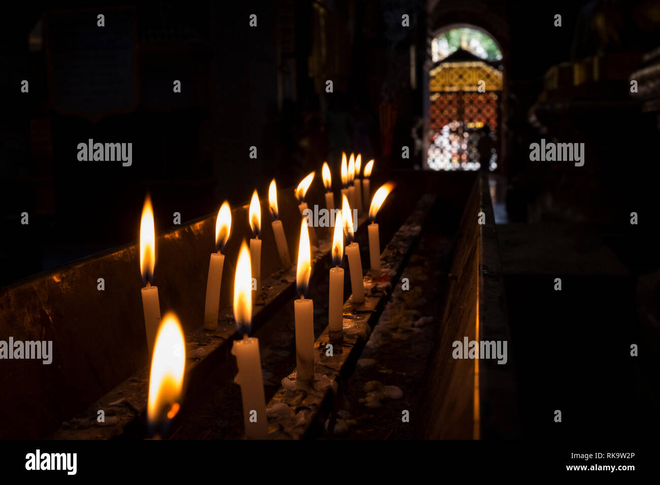 Monywa, Myanmar - 24 September 2016: Burning candles inside Thanboddhay ...