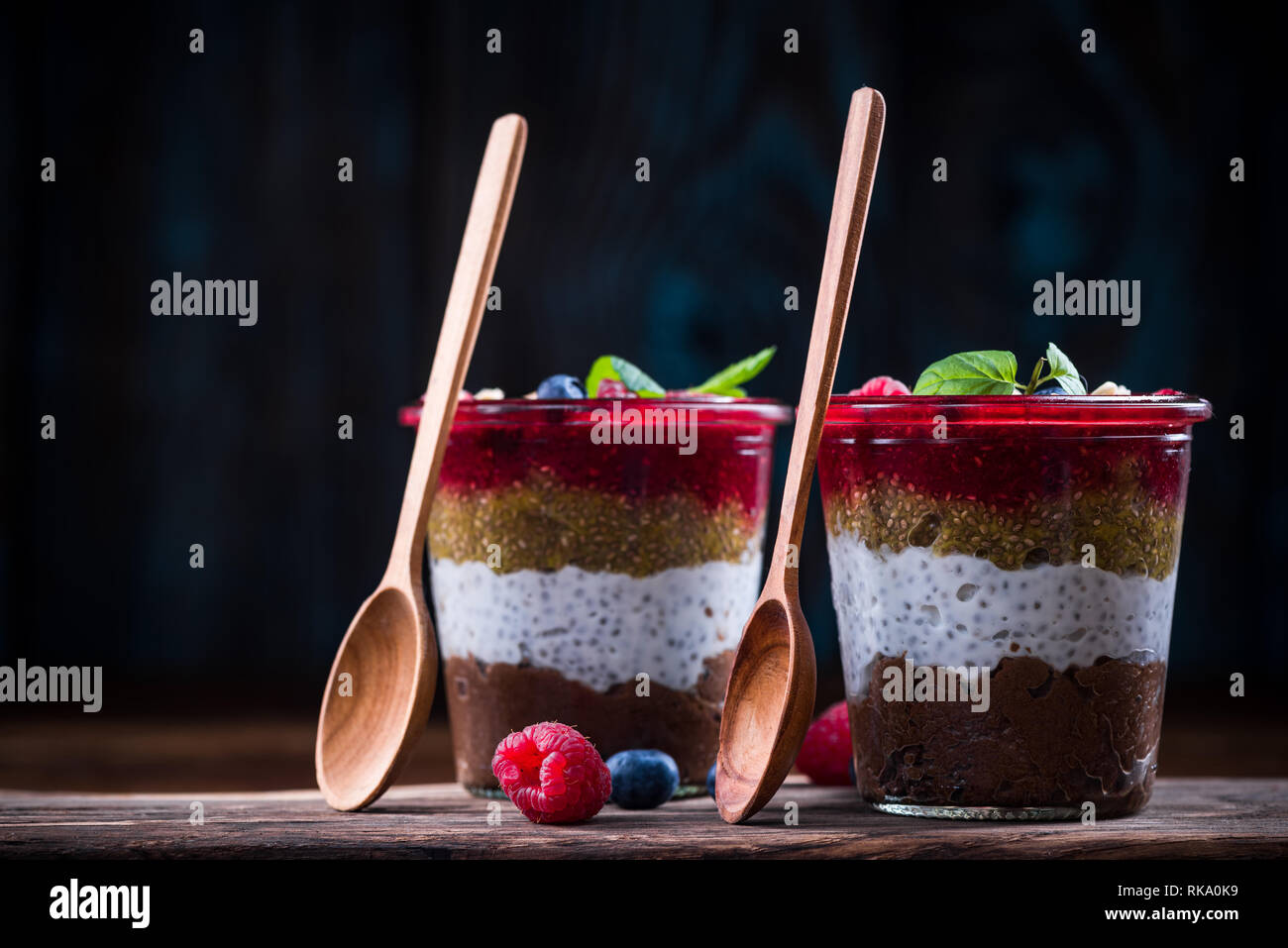 Raspberry and chia dessert layered in jar. Healthy and clean eating ...