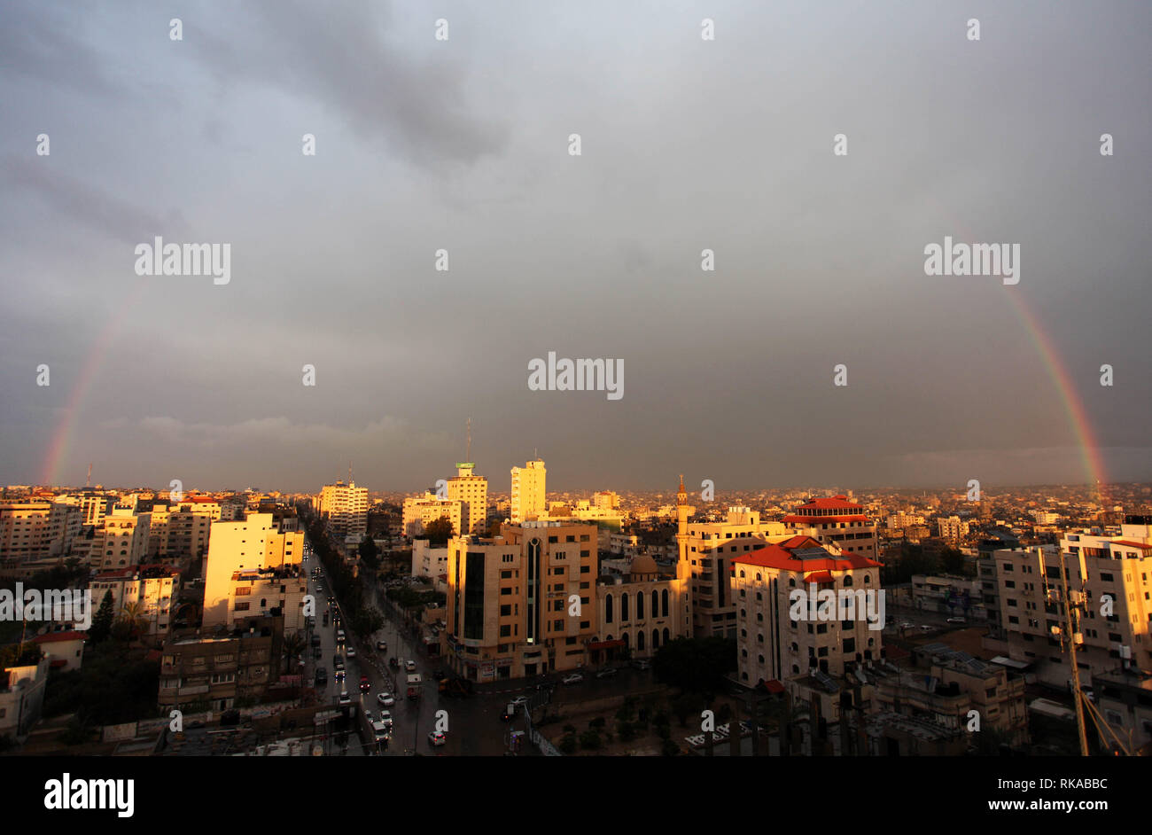 Gaza City, Gaza Strip, Palestinian Territory. 10th Feb, 2019. A rainbow appears above buildings ...
